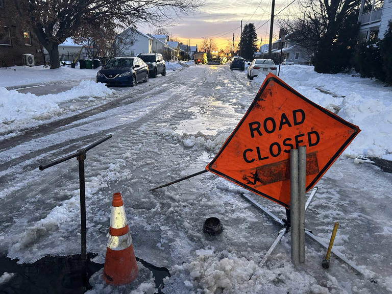 Water main break floods roads, turns travel icy