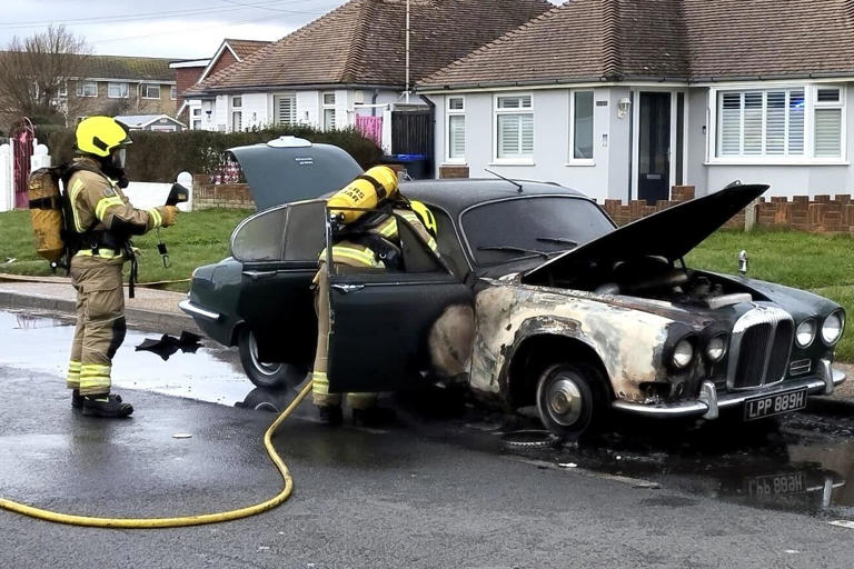 Police officers join emergency response to car fire in West Sussex village