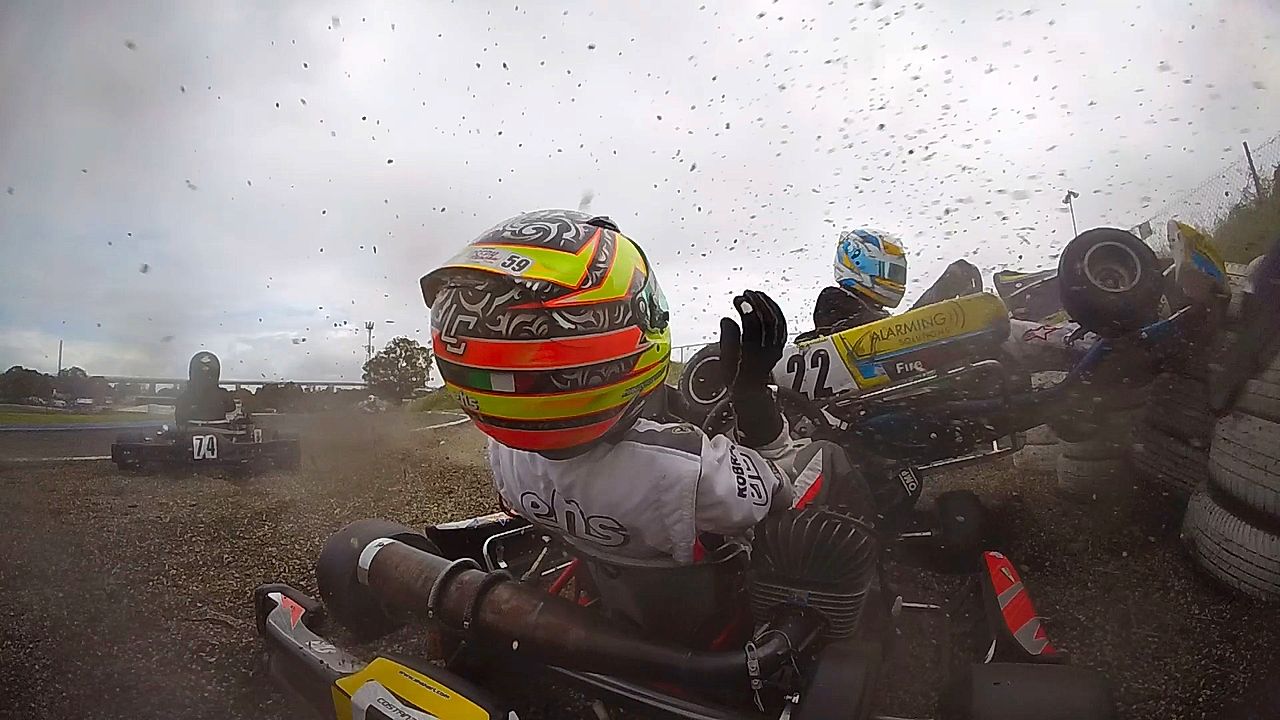 Sudden downpour during race sends karts skidding into tire wall