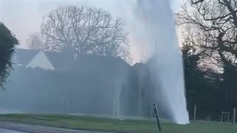 Burst water pipe sends jet of water 30ft into air