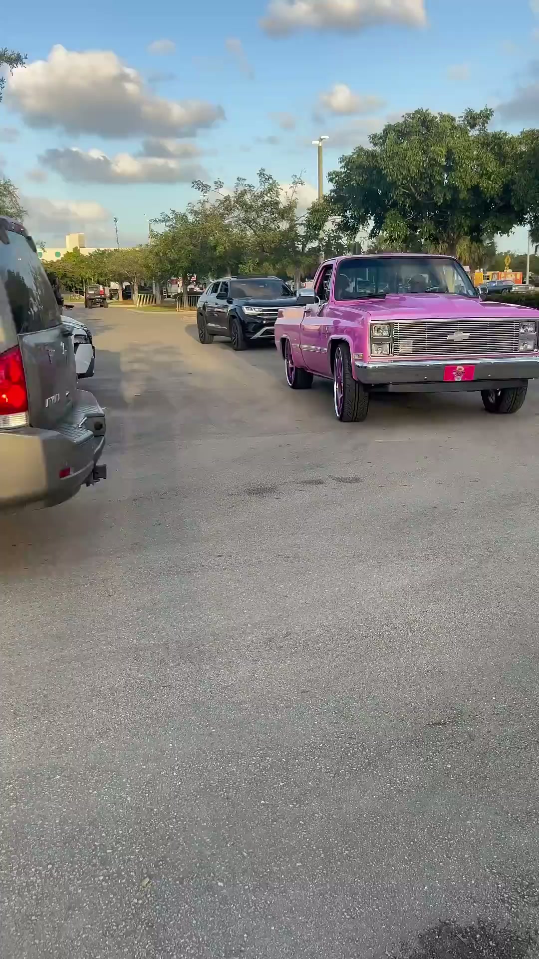 Her outrageous pink Chevy shortbed truck on 28’s Forgiatos