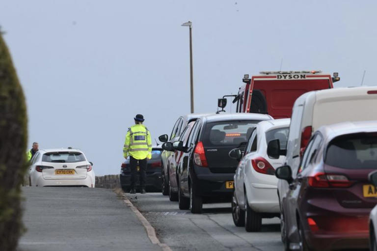 Trapped man freed after car crashes and ends up in ditch