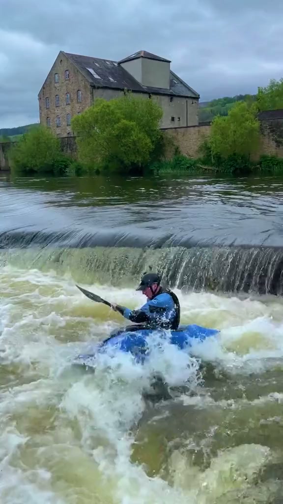 Kayak backflip over river weir goes surprisingly smooth