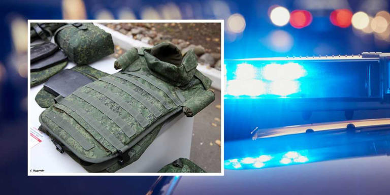 Man wears vest with rifle outside safety building: Police