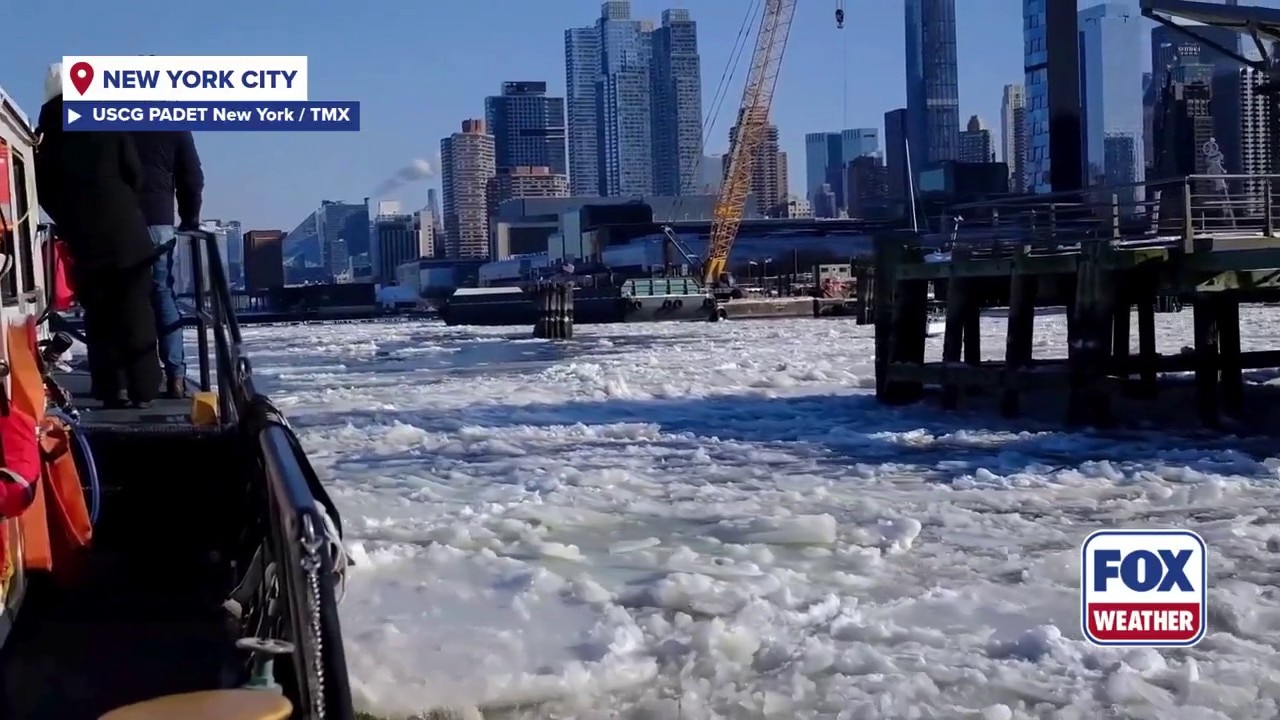 The U.S. Coast Guard free a trapped NYPD boat in ice