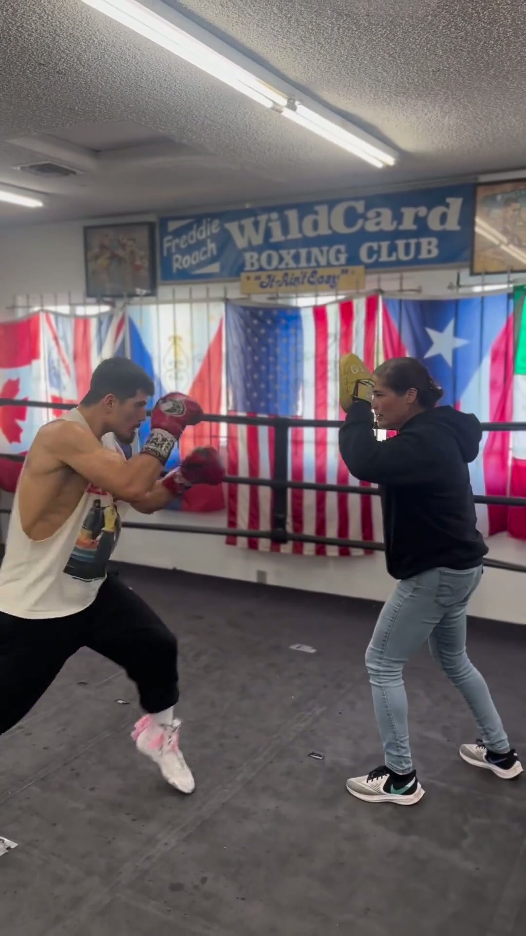 Alan Garcia firing laser sharp punches while working pads with coach Gee