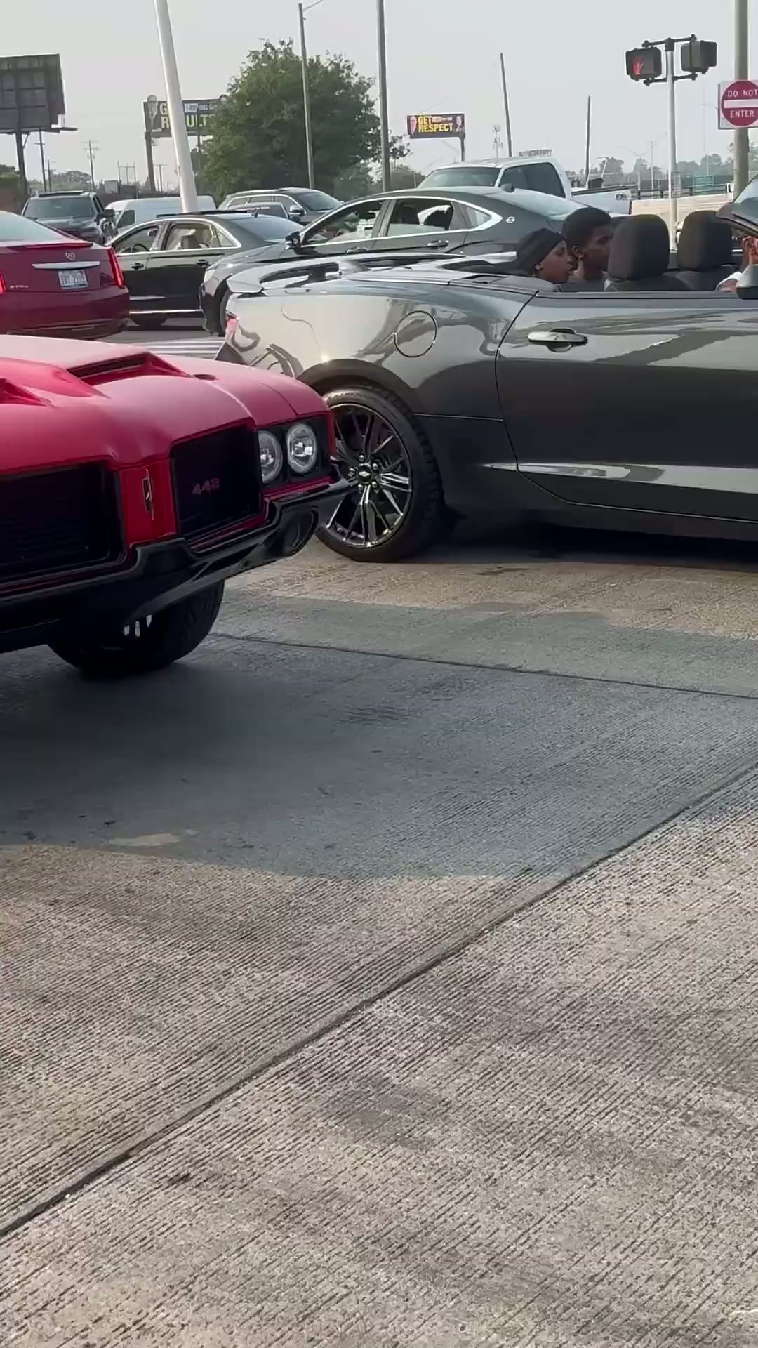 Red Oldsmobile Cutlass on 24’s riding