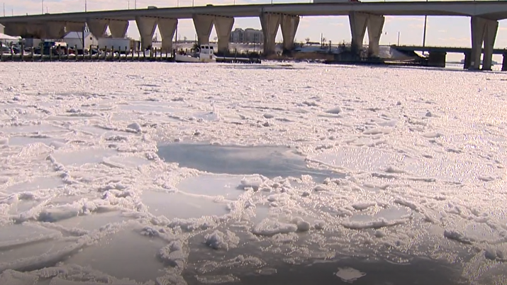 Ice-breaking boat cuts through frozen-over Chesapeake Bay in Maryland