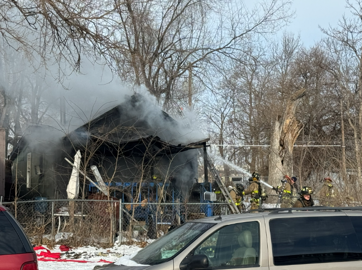 Topeka firefighters work to douse house fire Thursday morning
