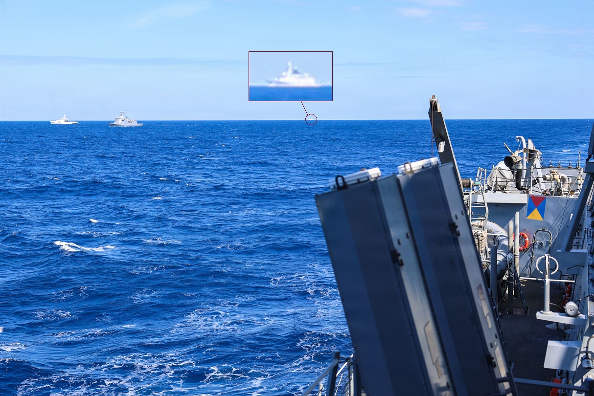 US military photograph shows Chinese warship shadowing naval drill