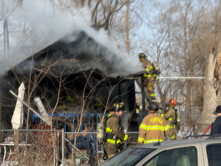 Topeka firefighters work to douse house fire Thursday morning