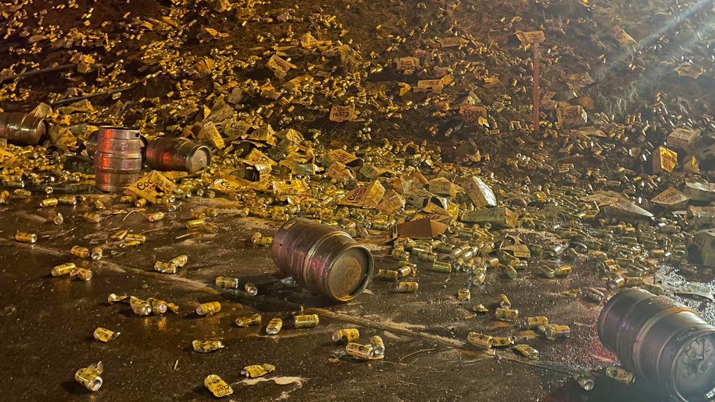 Coors Banquet cans, kegs scattered over Colorado Highway 58 after semi ...