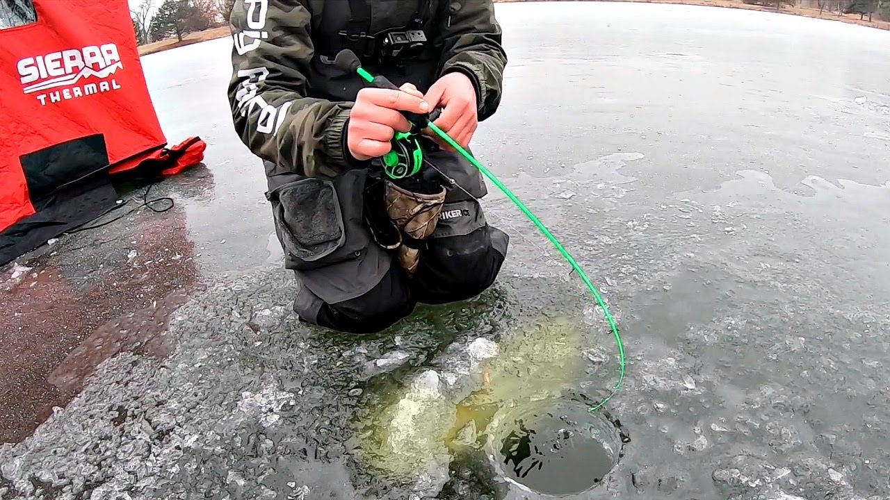 Catching biggest bass ever through clear ice conditions