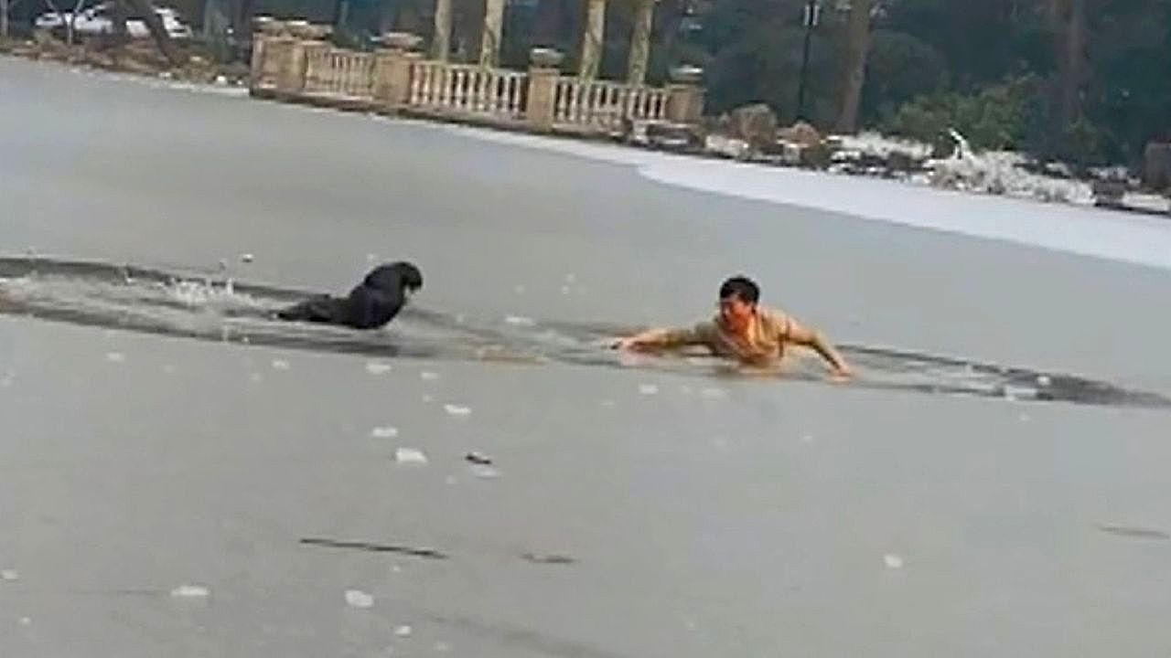 Man plunges into icy lake to save child after ice breaks in China