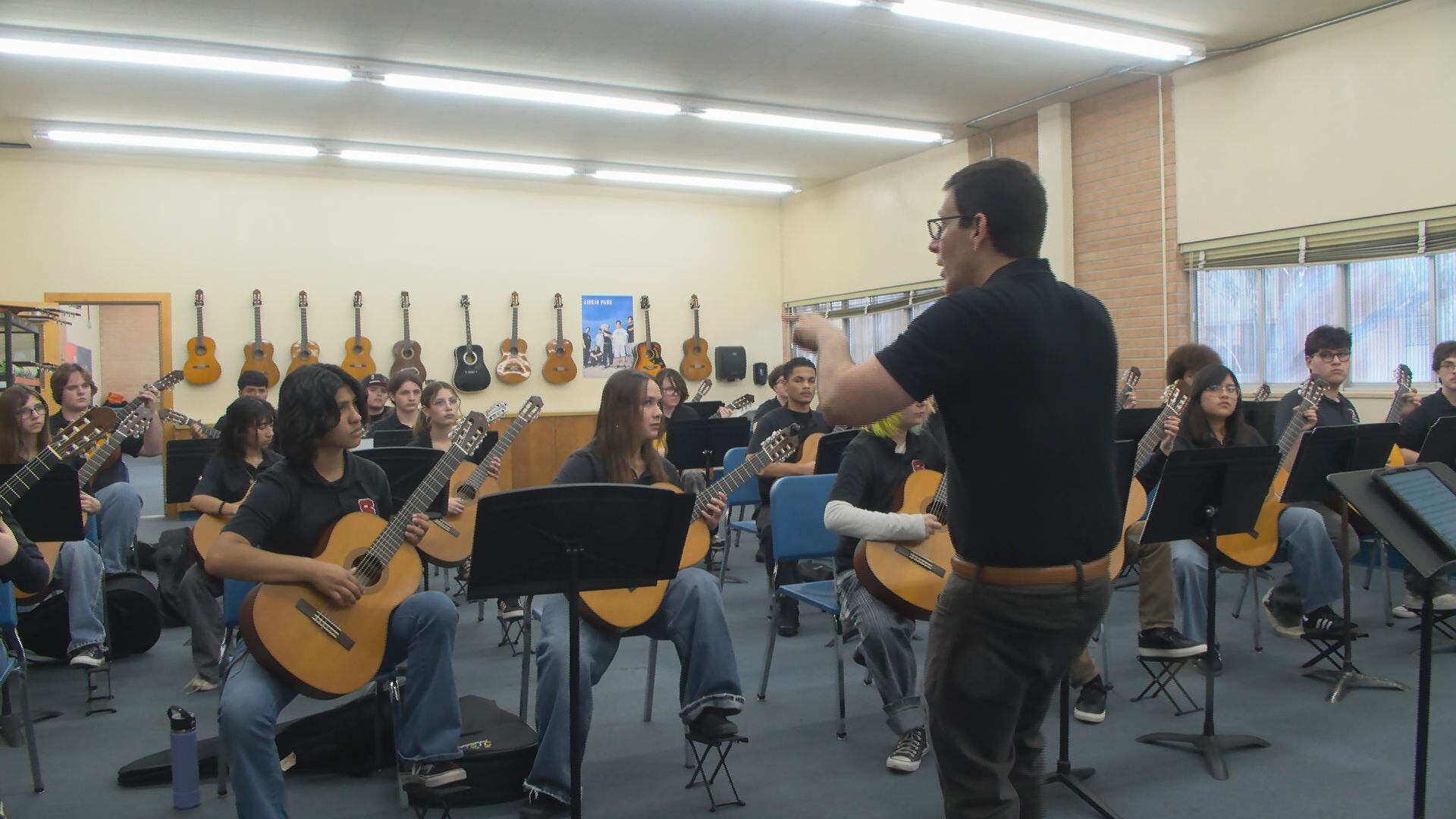Music programs improve high school graduation rates as local guitar ...