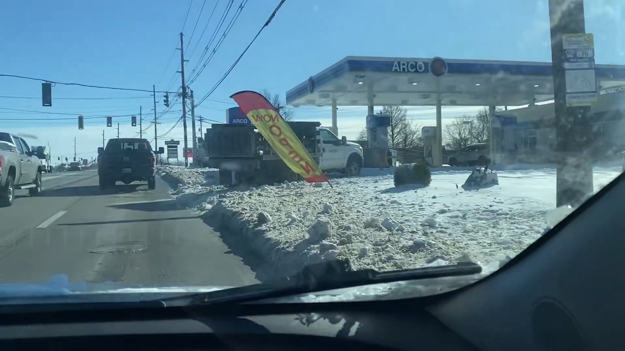 Vehicles navigate deep, uncleared snow after winter storm in Frankfort ...
