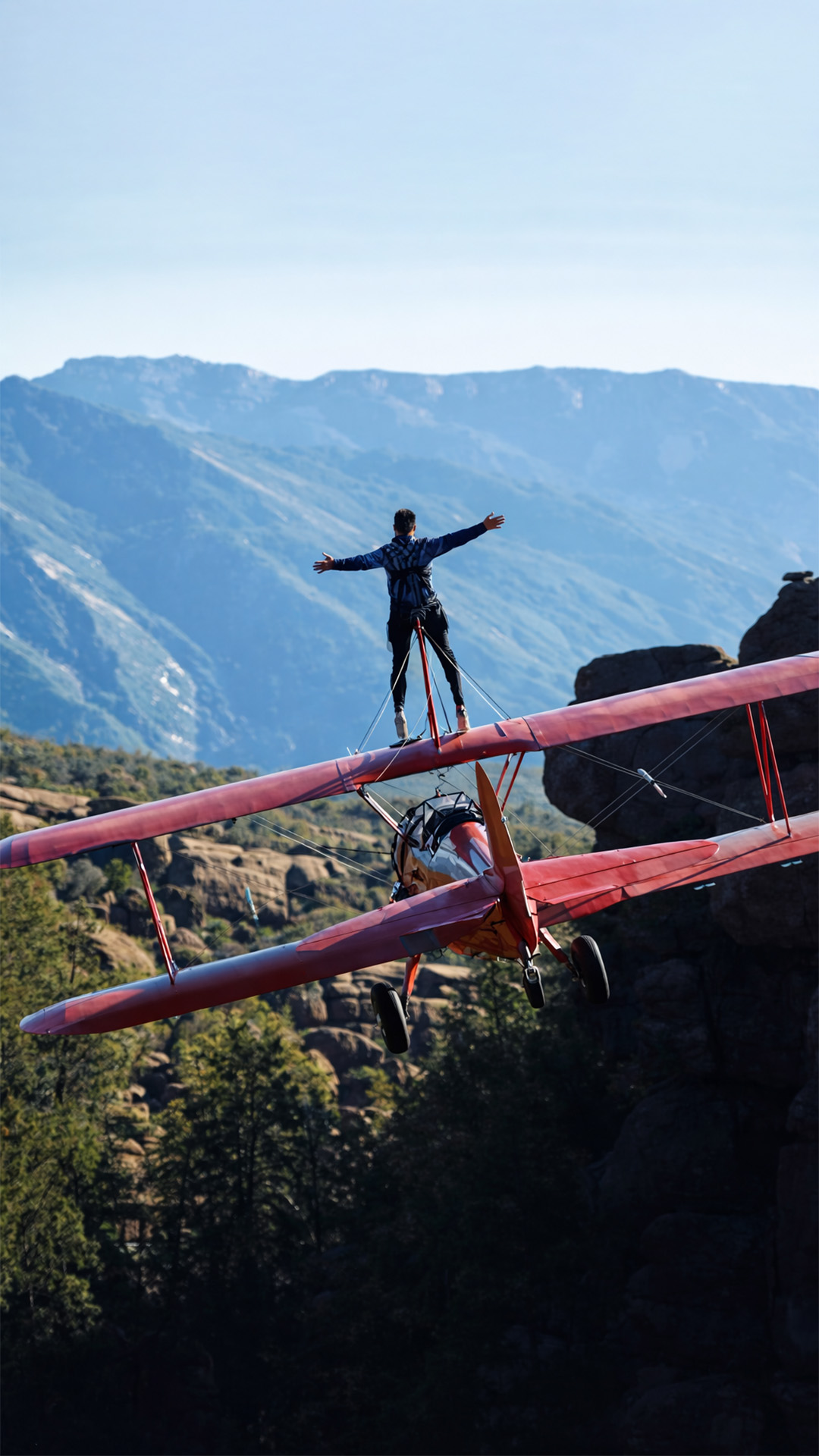 Standing on top of airplane wings