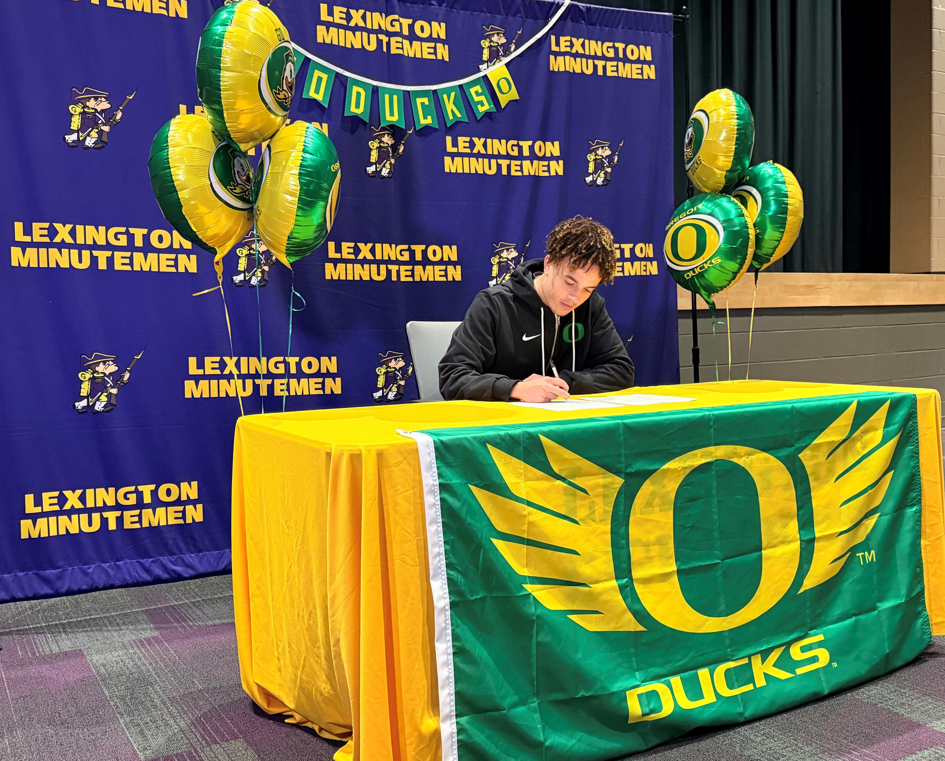 Lexington's Latrell Hughes signs with Oregon track and field
