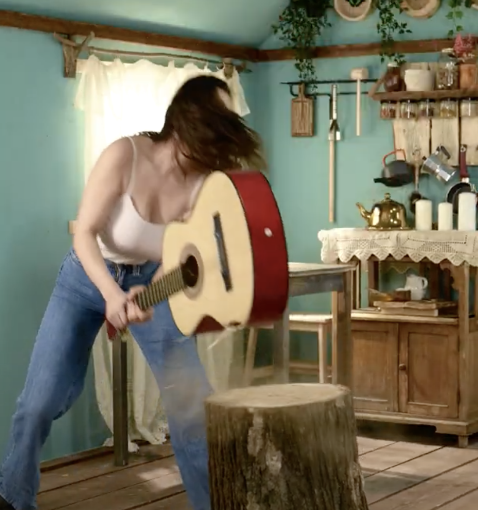 Girl transforms broken guitar into stunning art