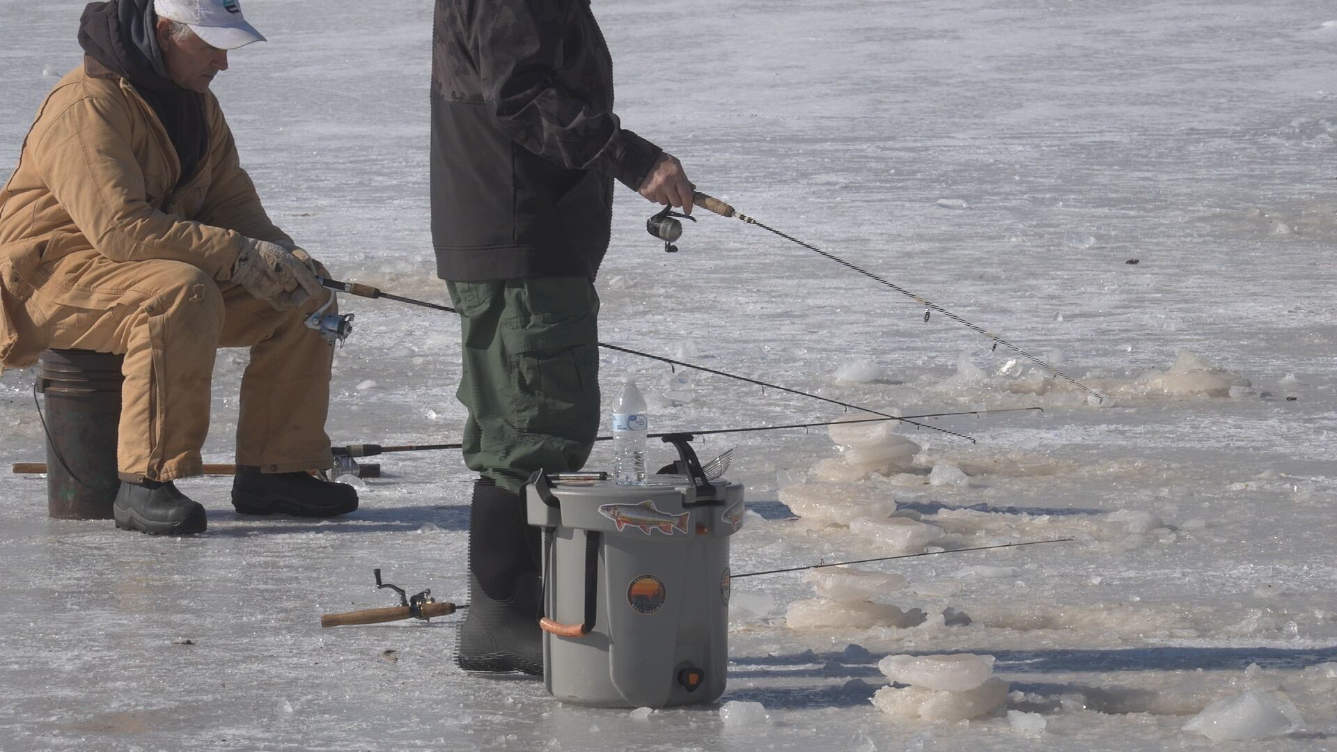 Residents enjoy the cold weather by ice fishing in Ravenswood
