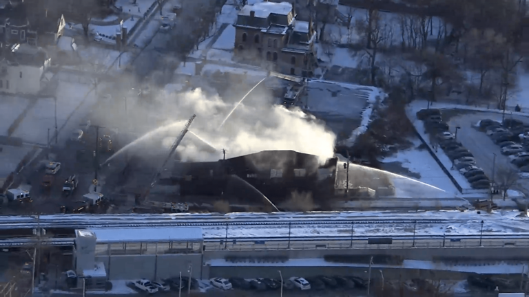 Street blocked as crews fight blaze that partially collapsed suburban ...