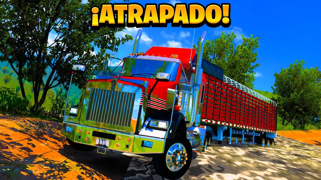 Tracto mula T800 atrapada en el río