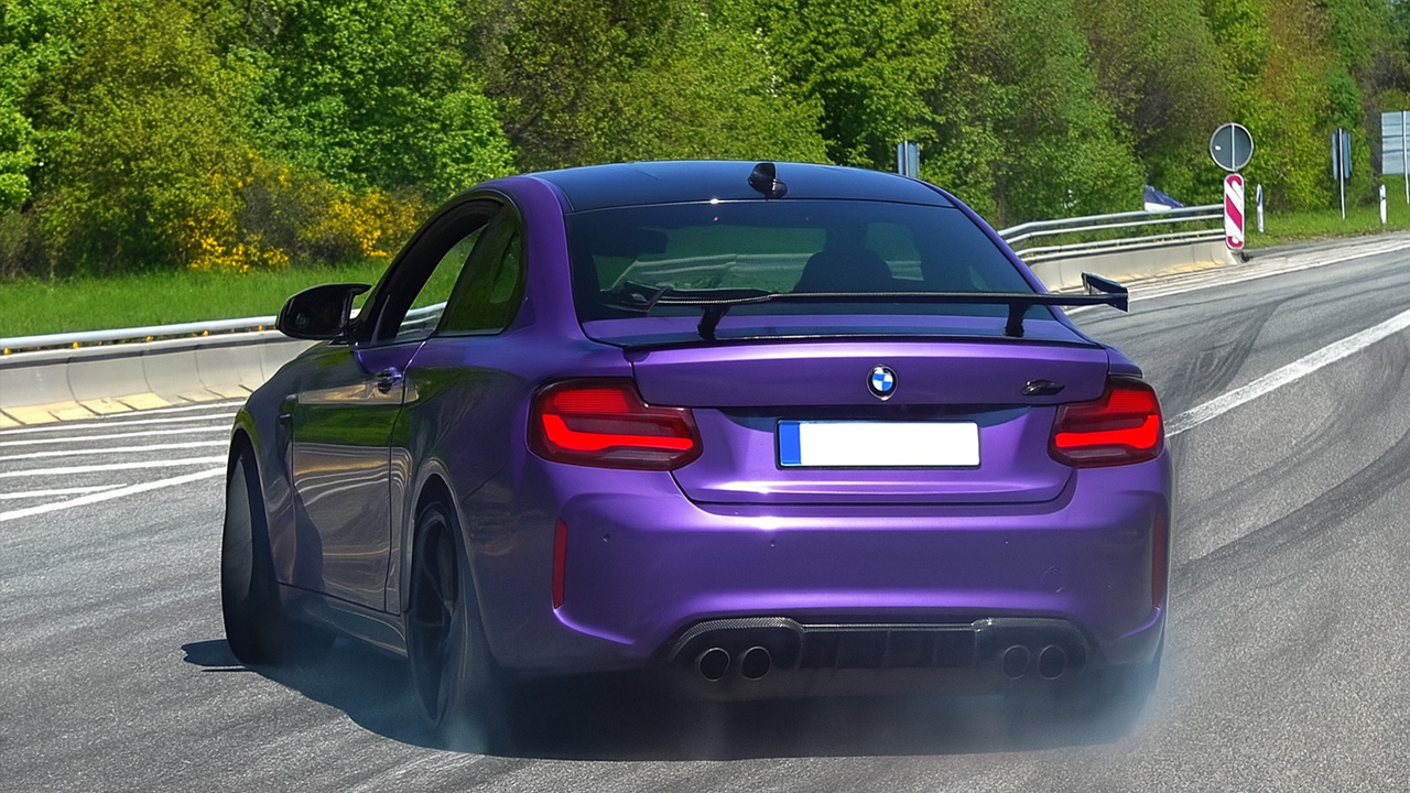 BMW M2 lighting up the asphalt