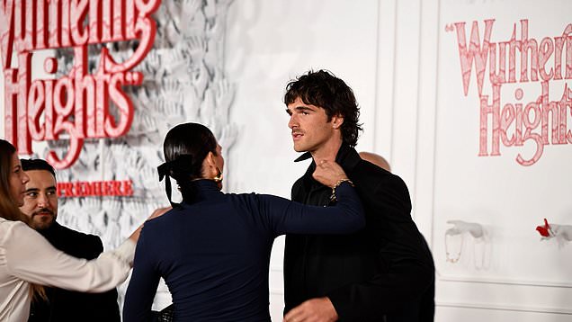 Jacob Elordi's mum fixes his collar at Wuthering Heights premiere