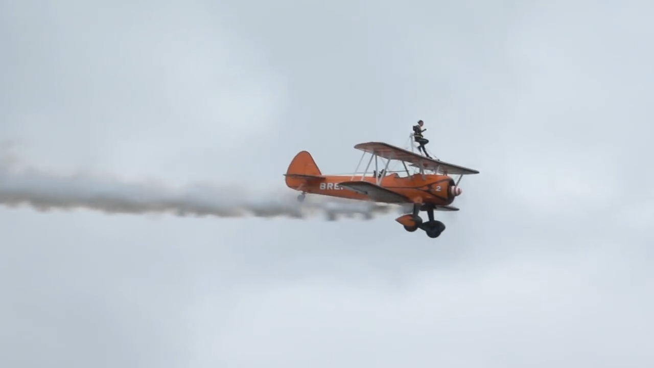 Why someone would stand on a flying plane