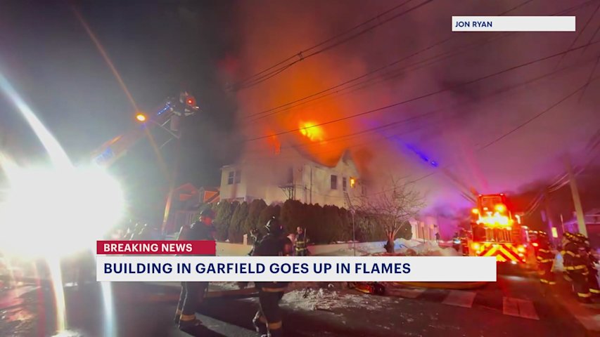 Crews battle flames and ice at Garfield building fire