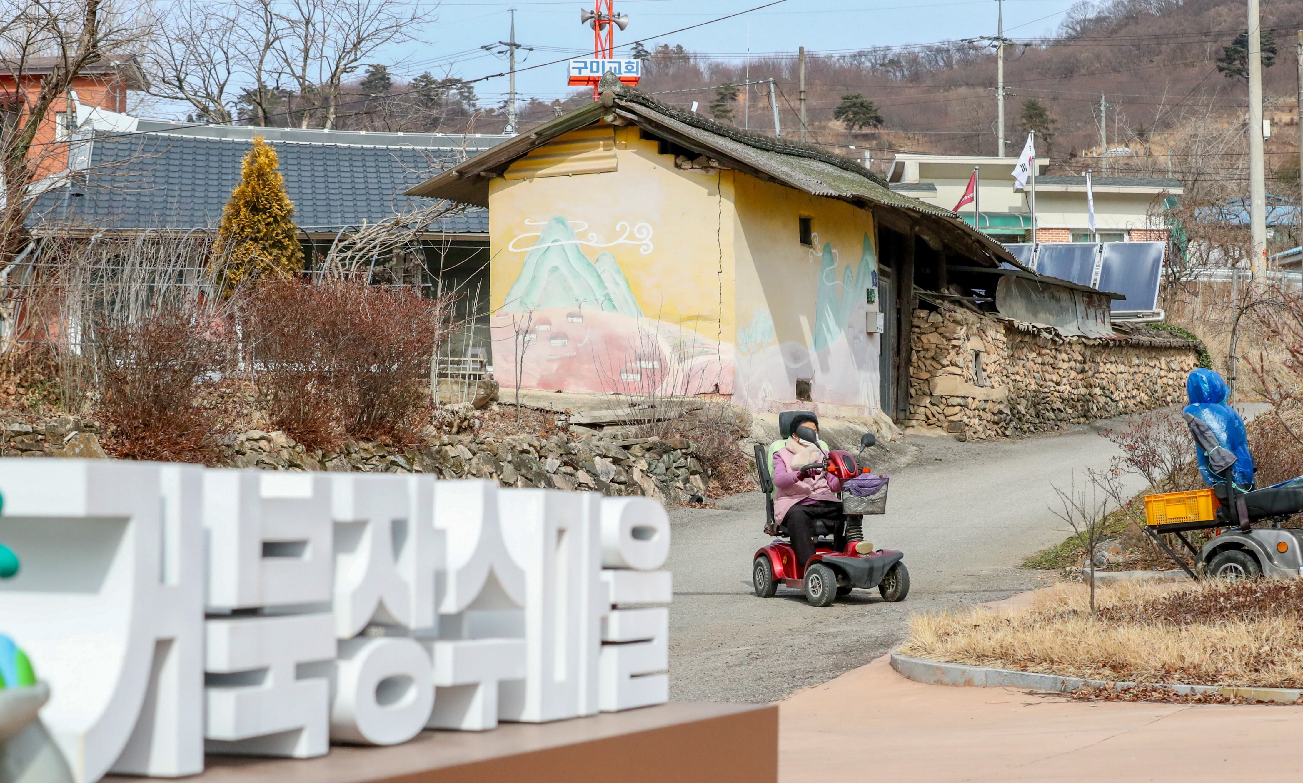 Scooters, chicken replace walking, vegetables in former longevity village