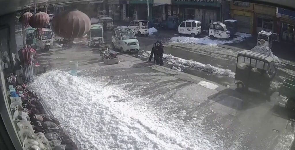Moment huge avalanche of snow falls from roof straight after man cleans ...