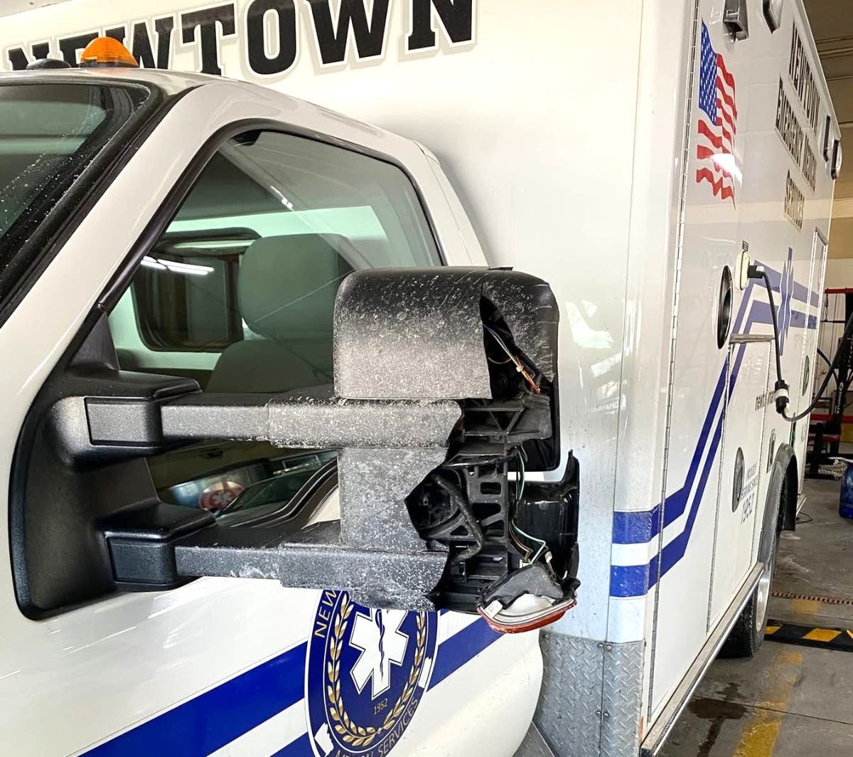 Newtown ambulance damaged by hit and run driver