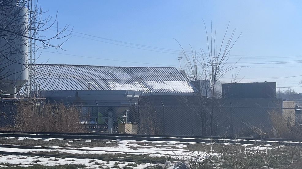 Crews respond to Friday morning warehouse fire; smoke seen from roof