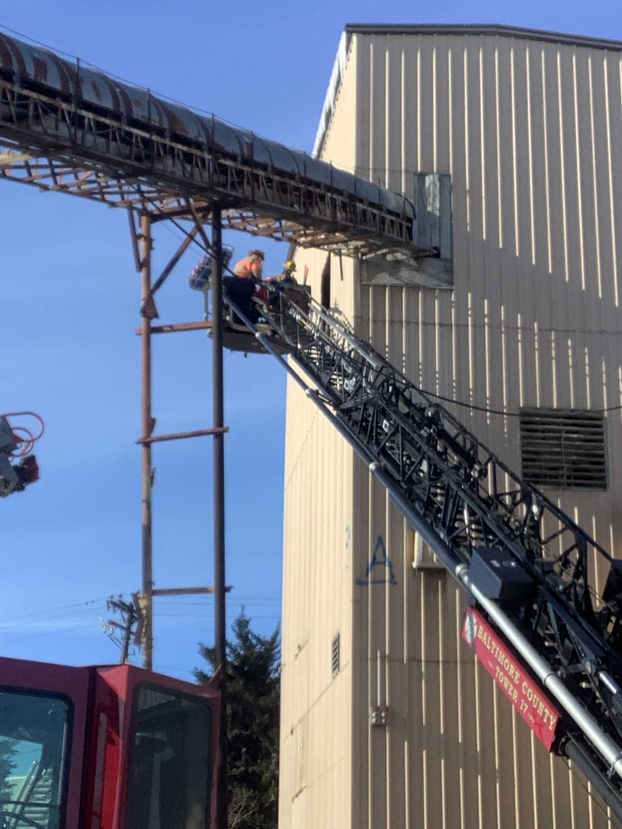 Maryland worker walks away after being trapped 75 feet up in sand ...