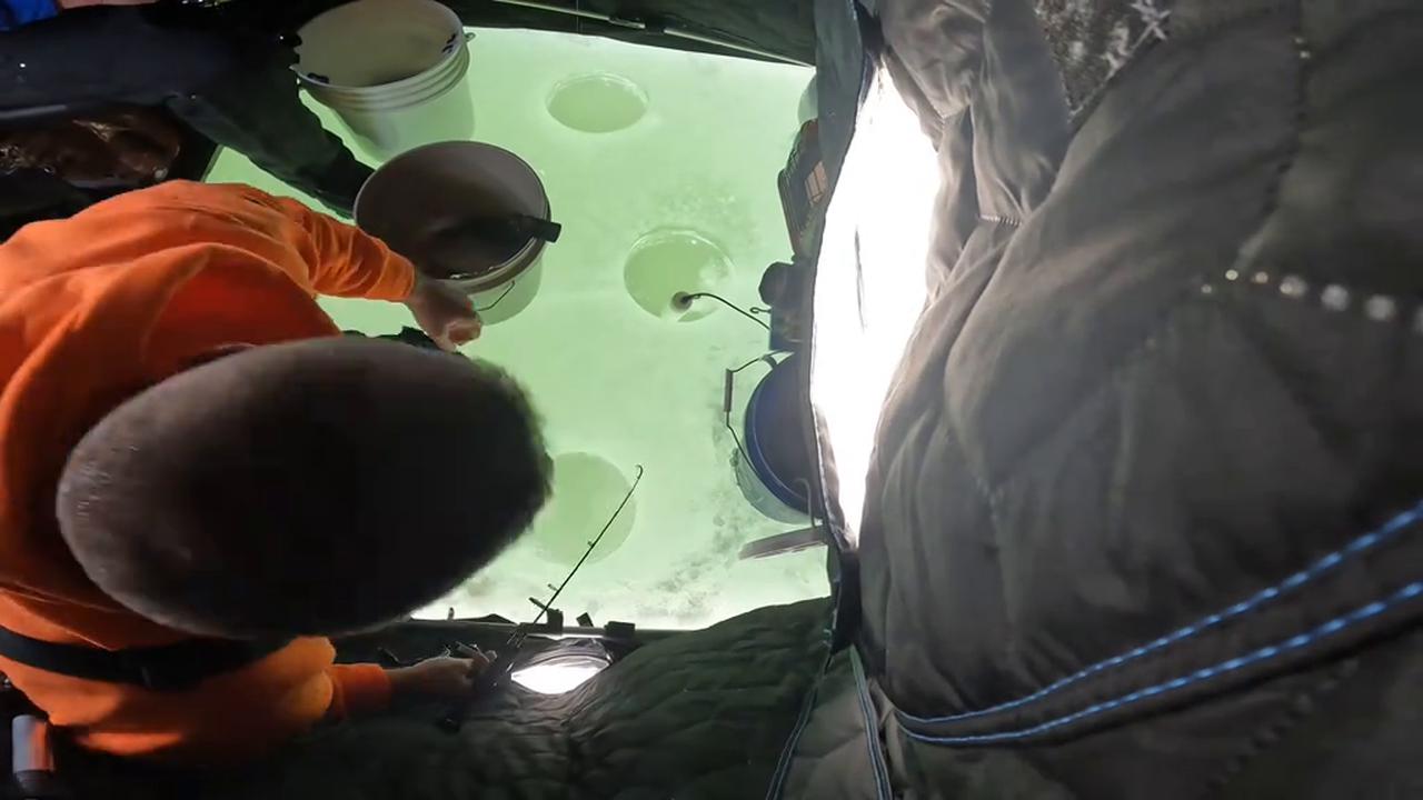 Fish makes a break for it during ice fishing trip
