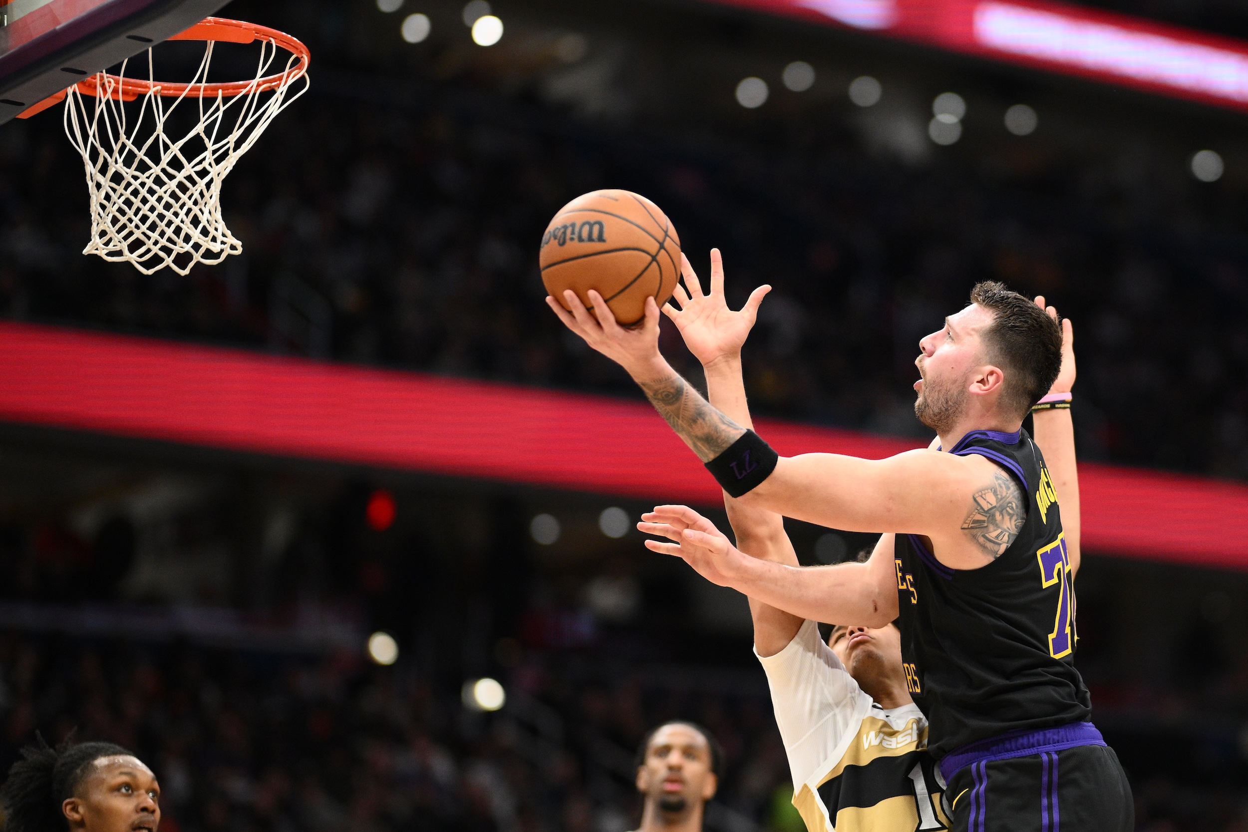 NBA: Luka Doncic has 26-point first half triple-double in Lakers win