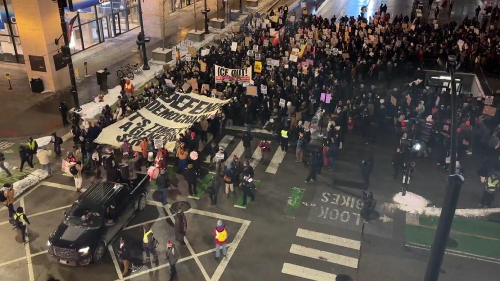 Demonstrators brave cold and snow for "ICE Out" protest in downtown Chicago