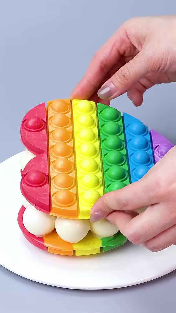 Making a rainbow pop it chocolate cake