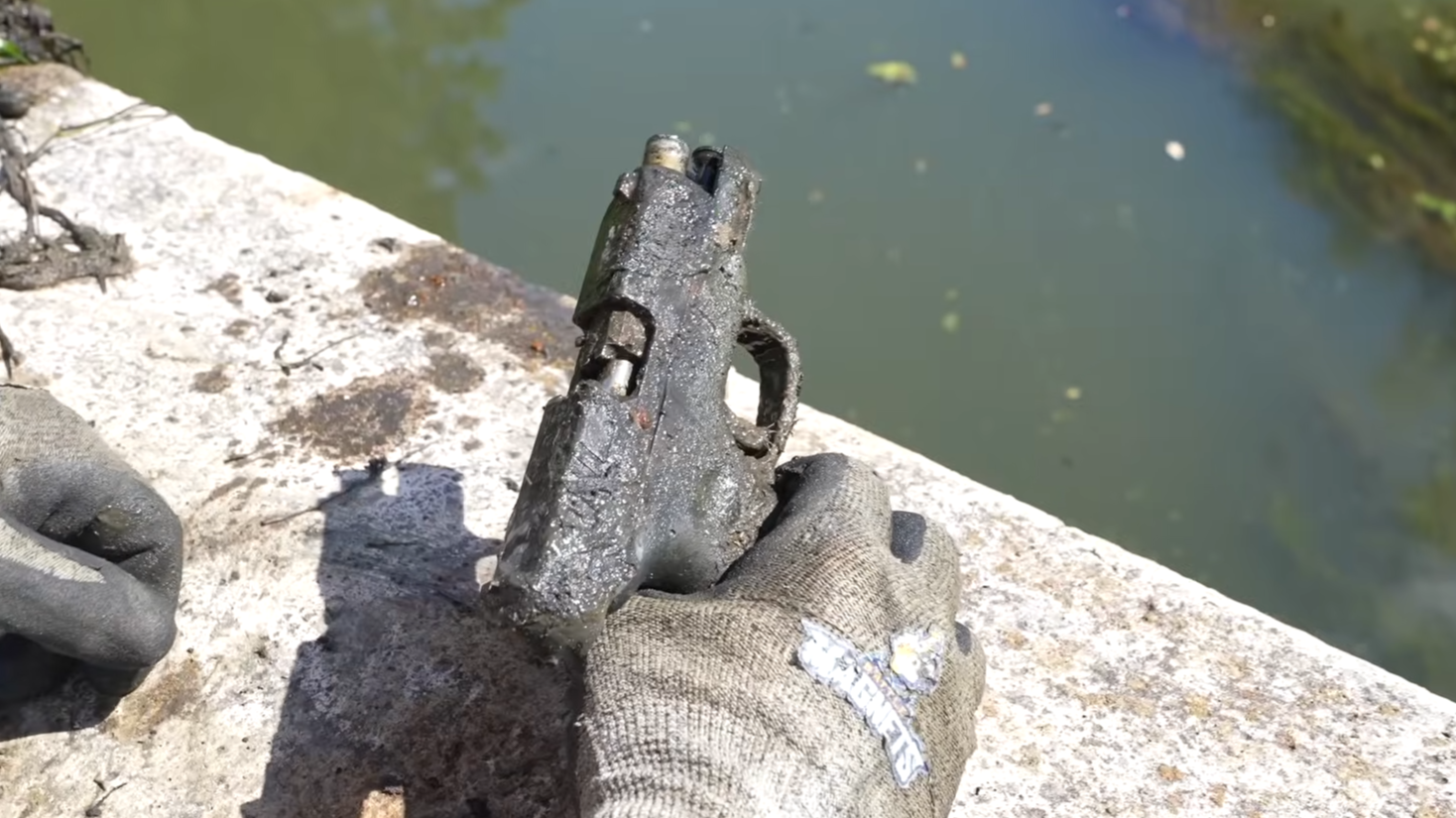 “Back up now” - Loaded gun pulled from the river