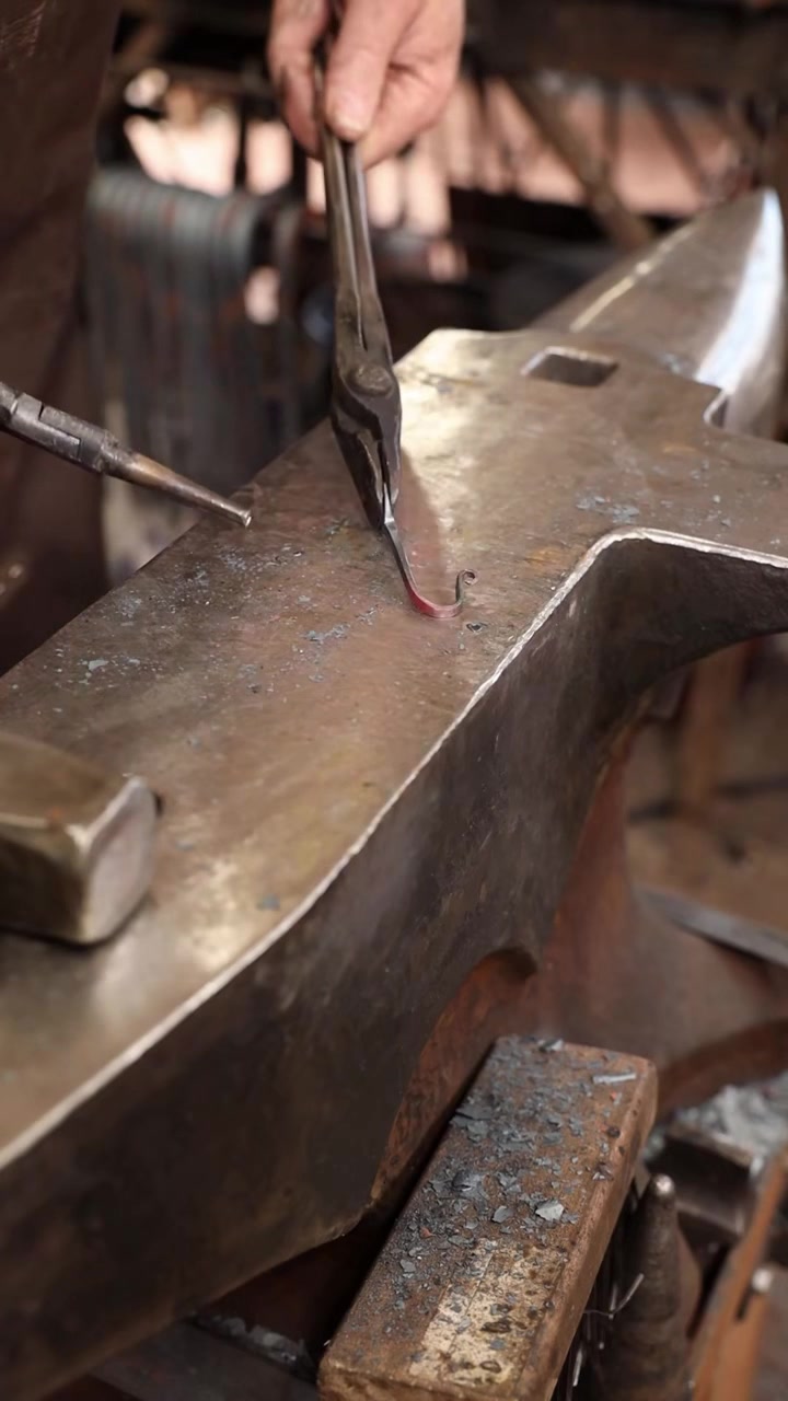 Forging a horseshoe nail hook