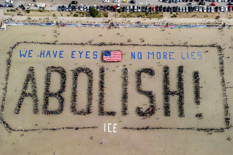 Photos: Hundreds of SF protesters form banner with message for ICE