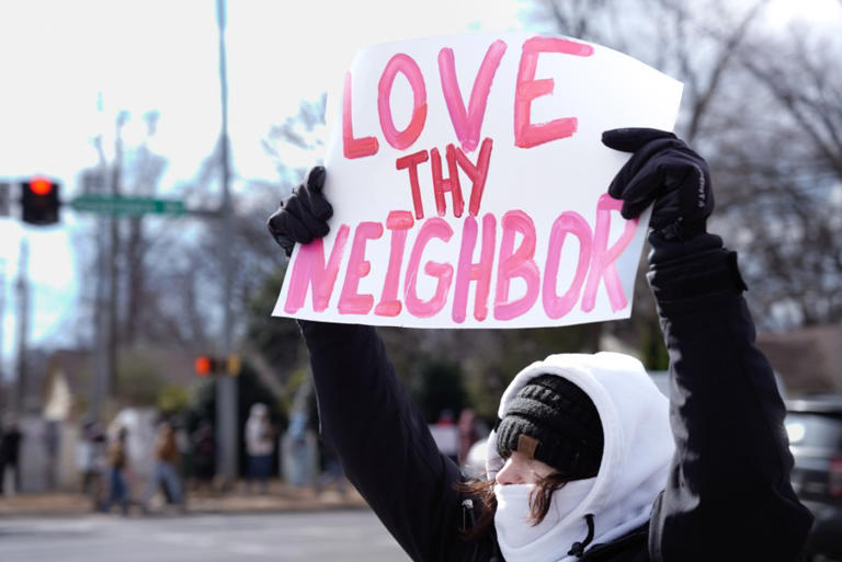 Crowd braves winter weather to protest ICE in downtown Huntsville