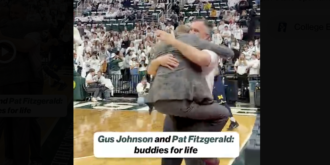 Football coach shares warm embrace with announcer