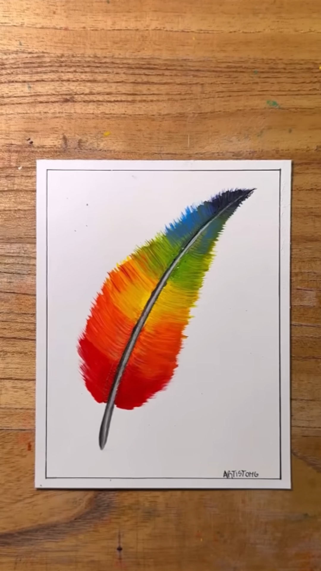 Painting a rainbow feather using an angle brush