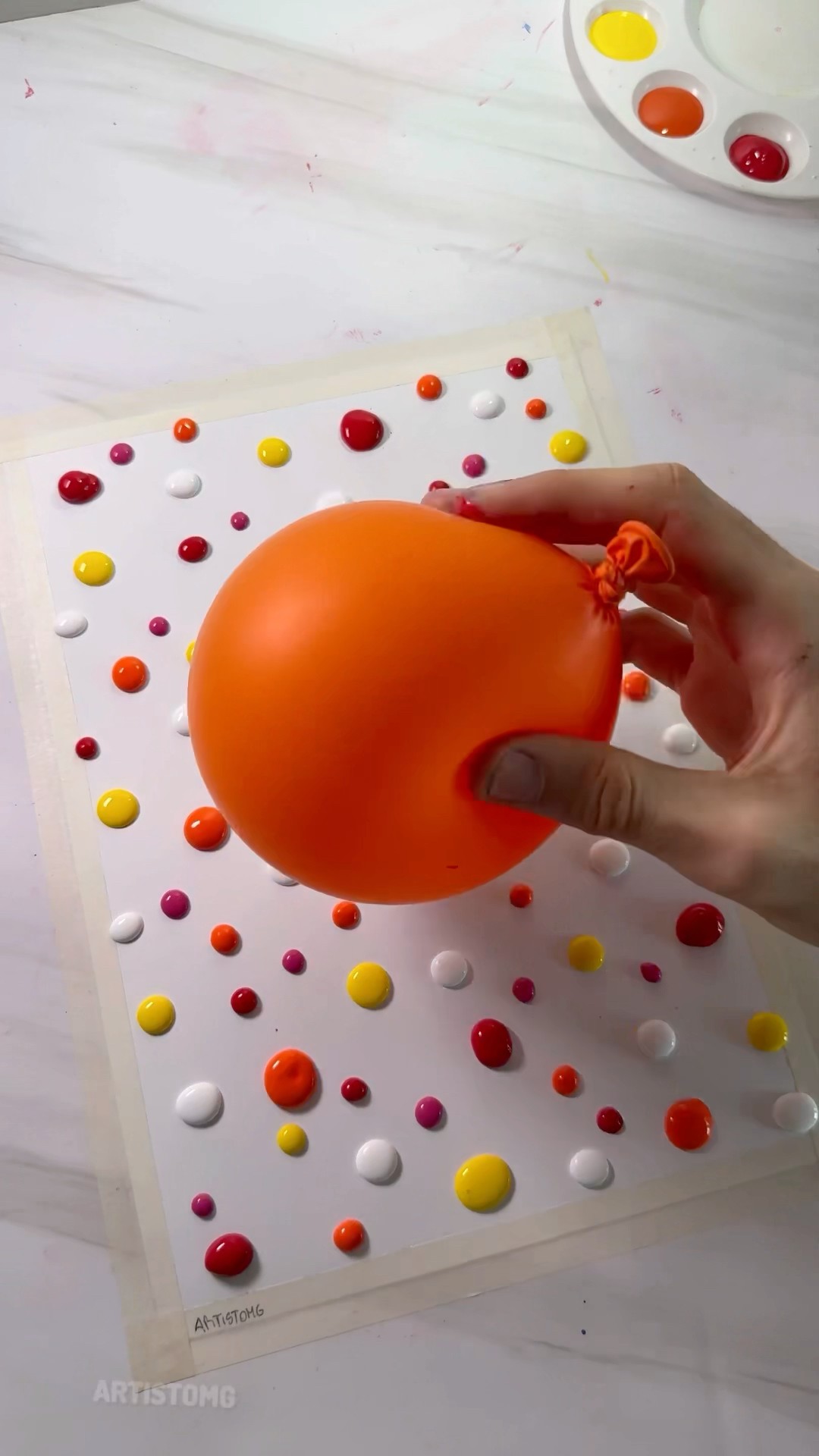Creating abstract art with balloons and acrylic paint