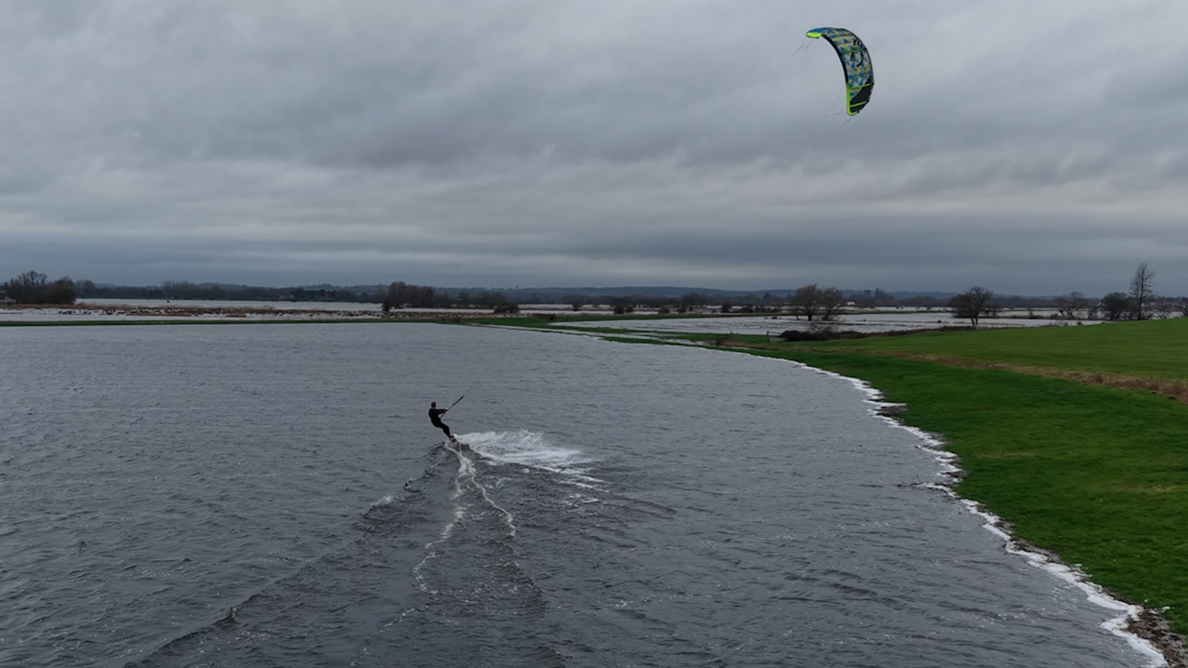 Thrill-seekers use Storm Chandra flood water to go kite surfing