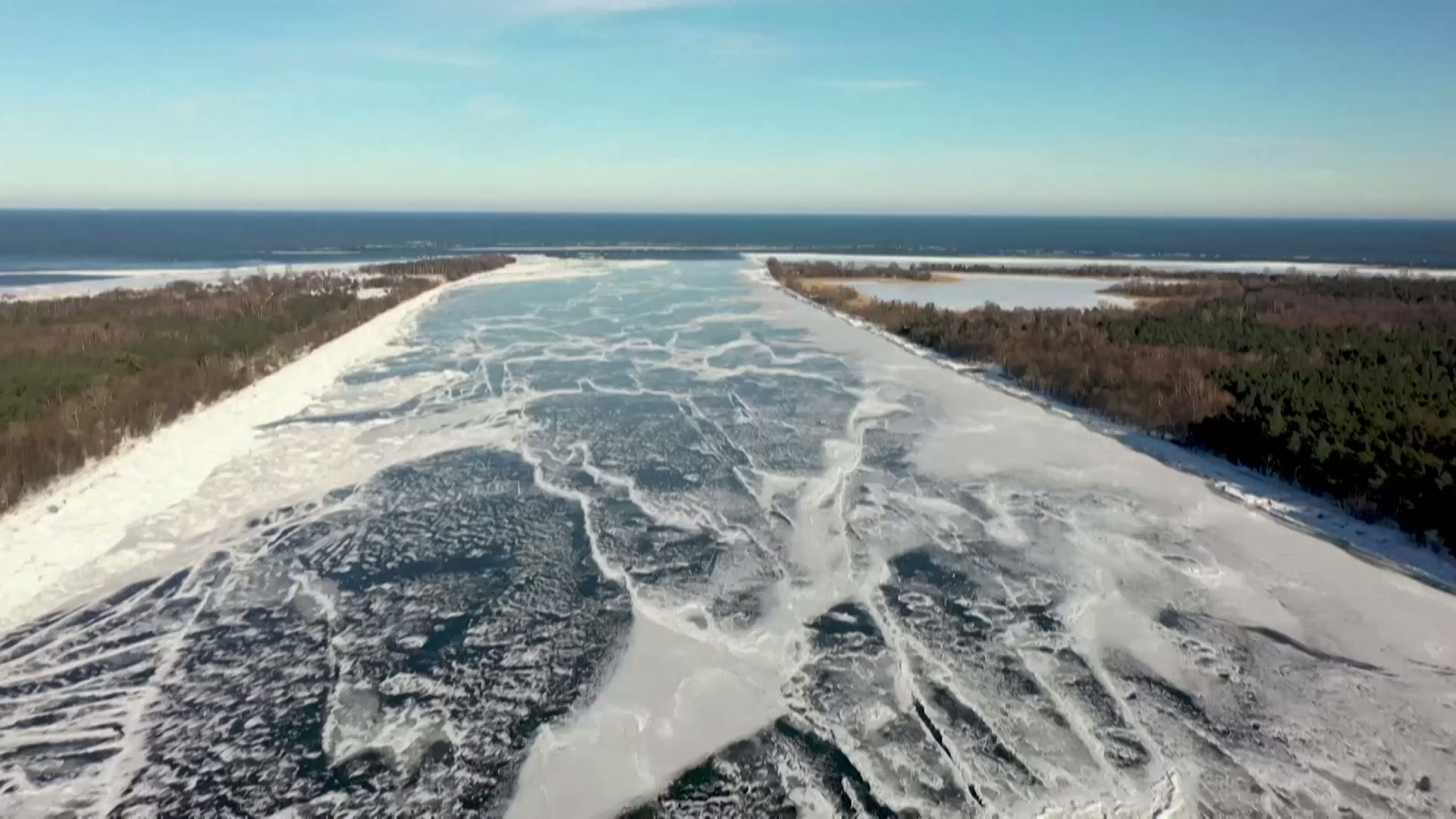 Poles flock to frozen Baltic Sea beach as temperatures plunge