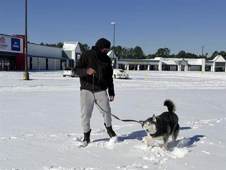 Spring Lake presses on as rare snow blankets town