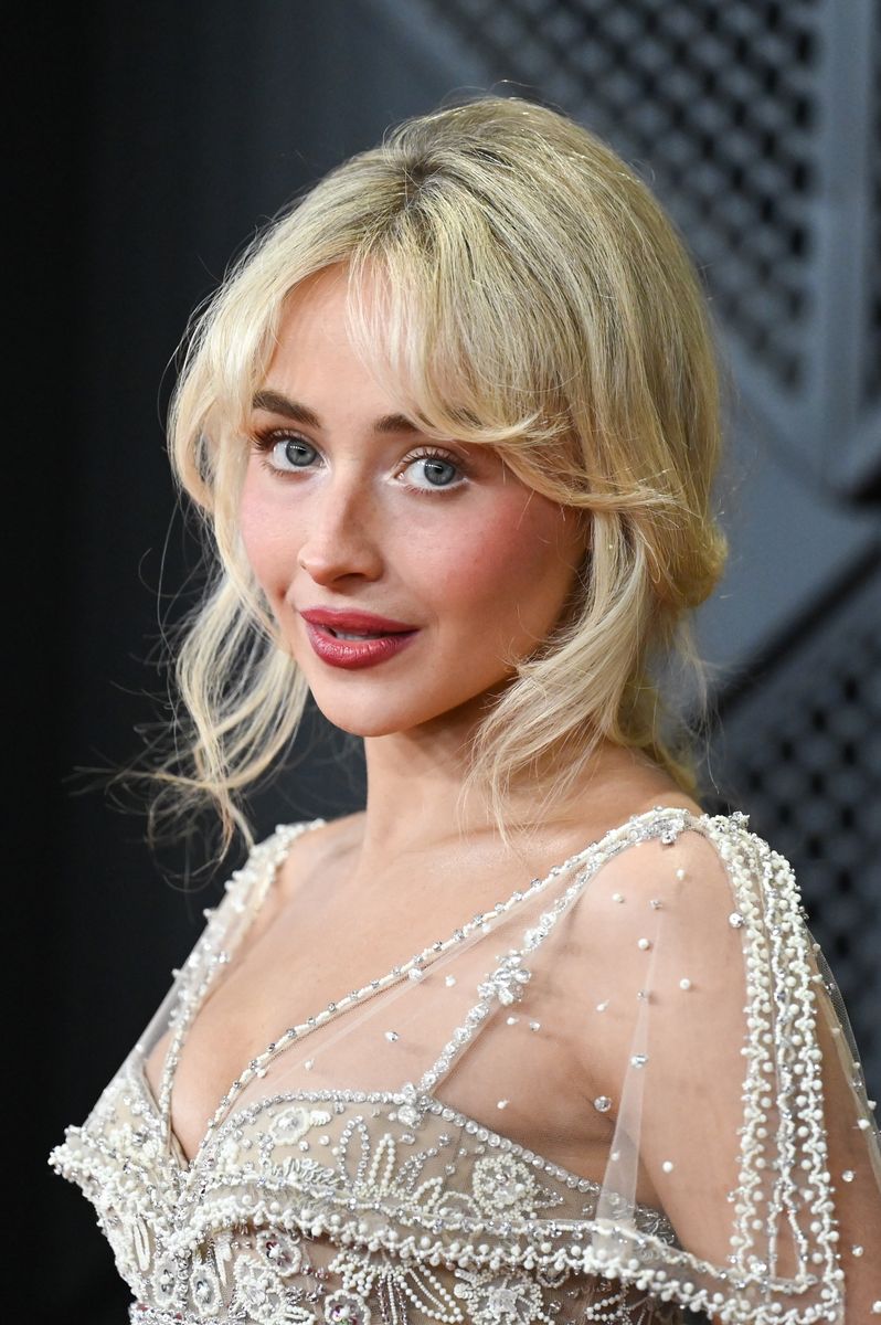 Sabrina Carpenter poses in sheer beaded gown with floral bodice at 2026 ...